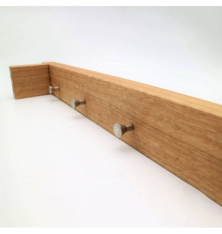 Minimalist wall-mounted coat rack in solid oak