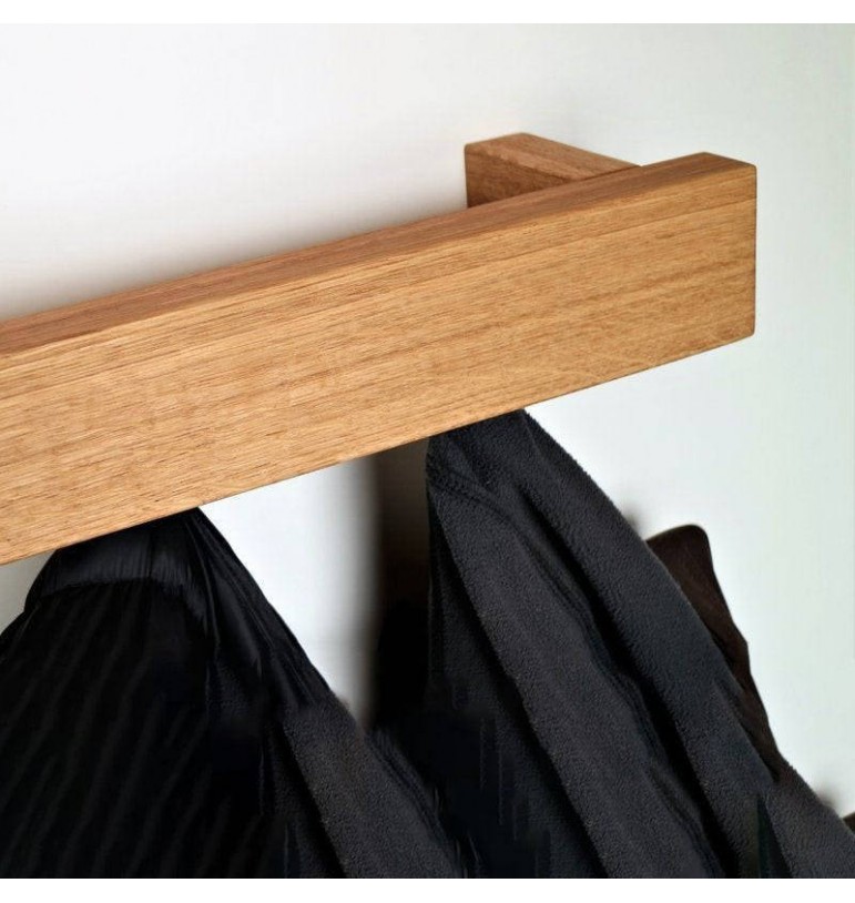 Minimalist wall-mounted coat rack in solid oak