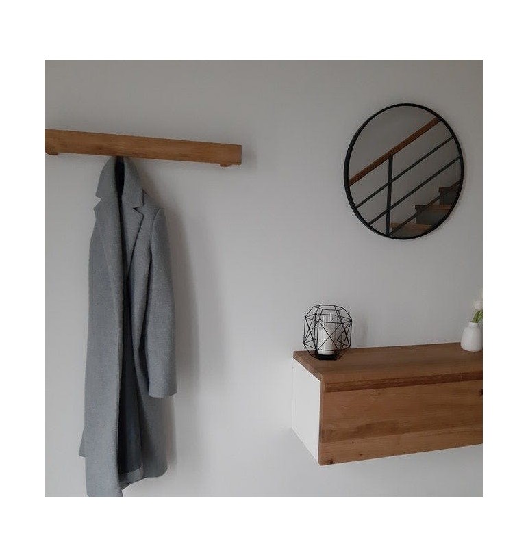 Minimalist wall-mounted coat rack in solid oak
